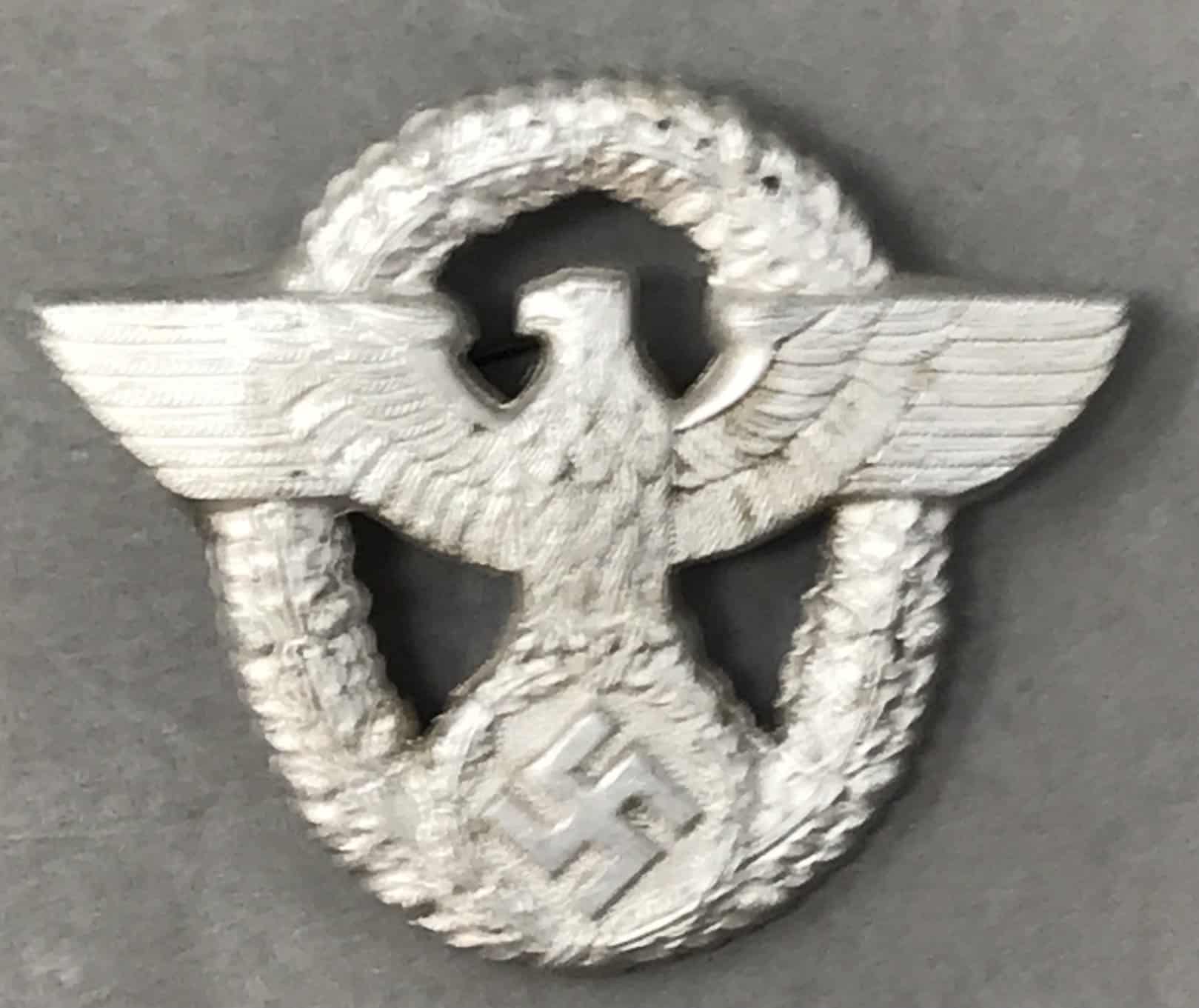 Discover WWII Police Badges: Nazi Visor Cap Findings