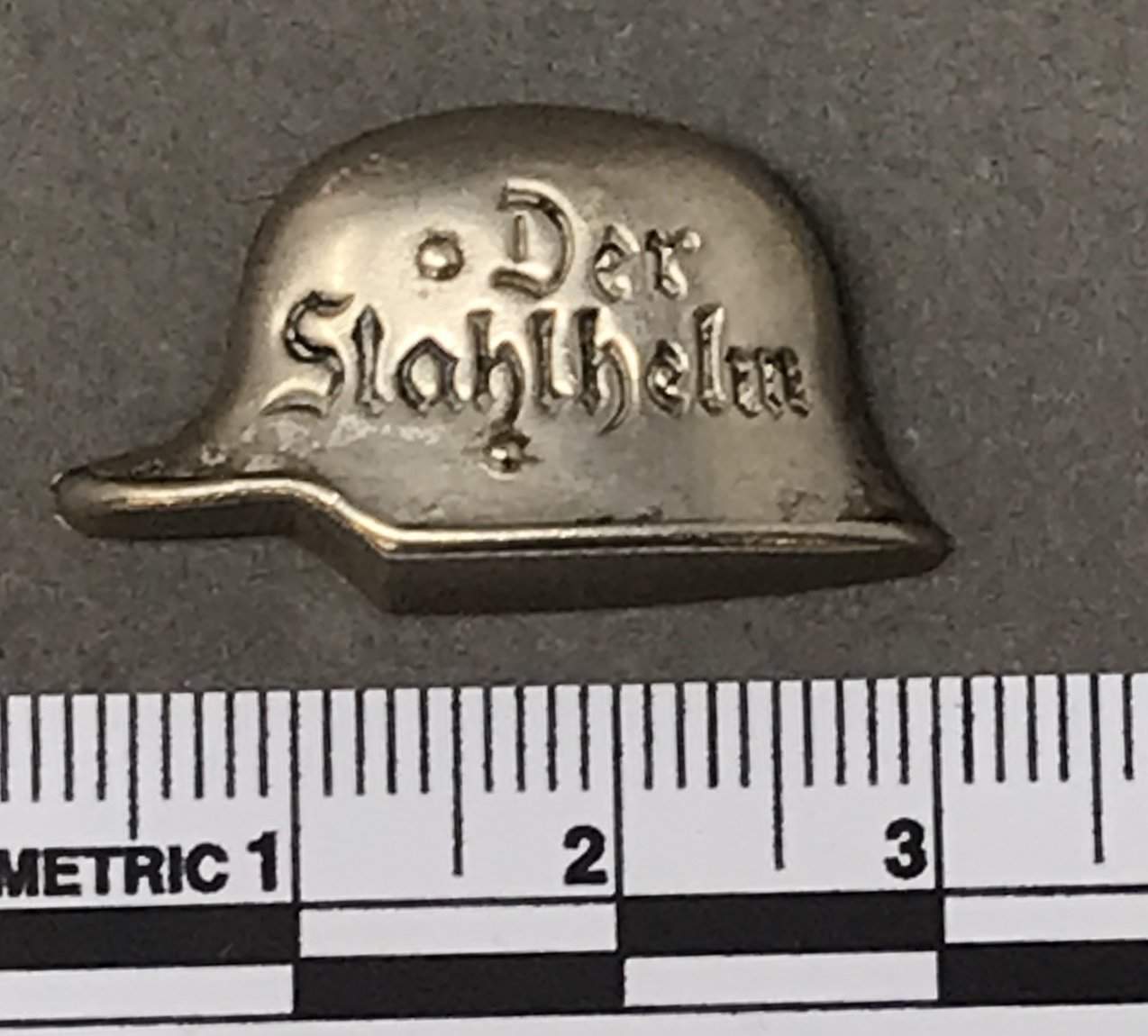 Explore WWII Relic: Der Stahlhelm Lapel Pin Certified