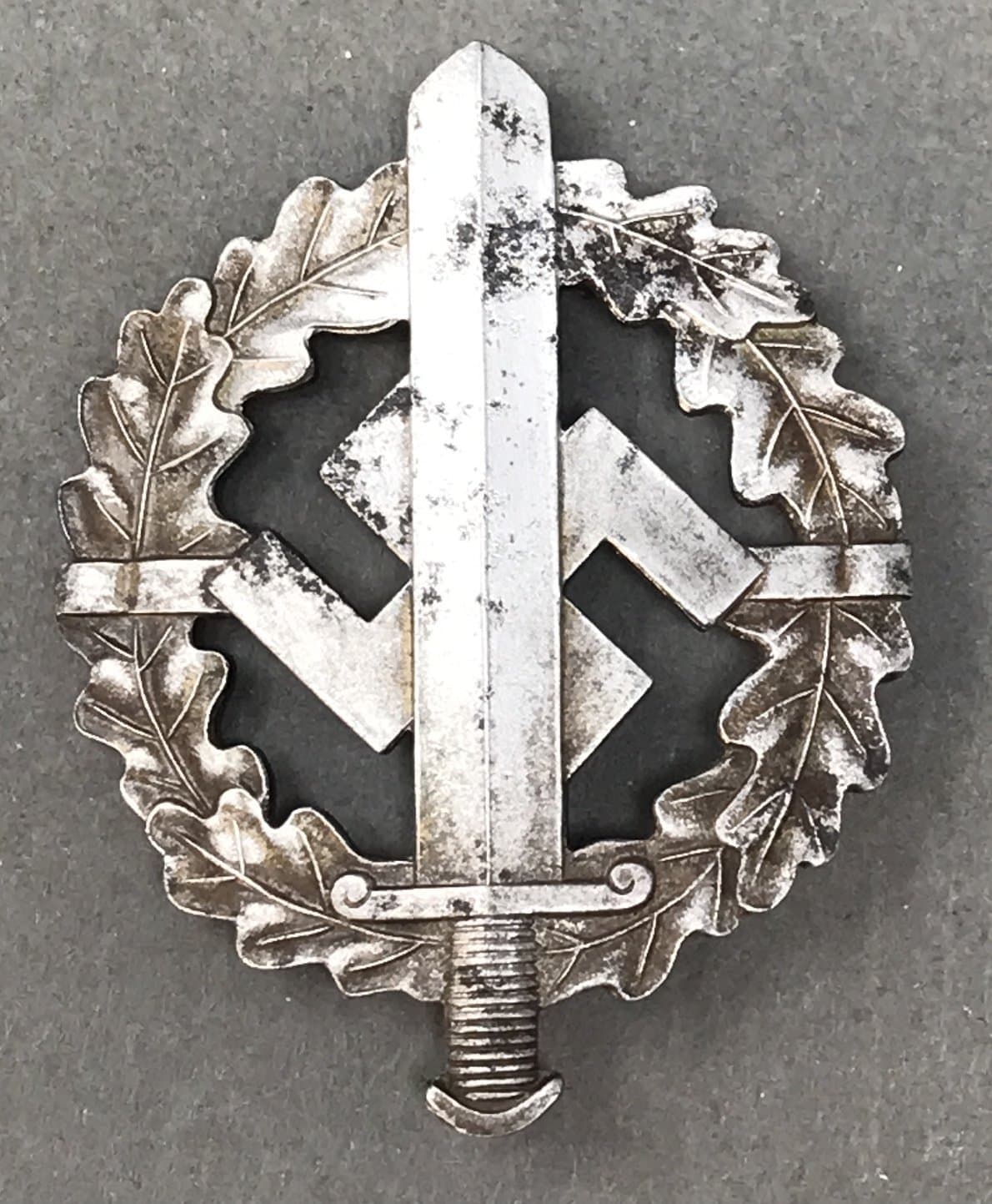 Uncover Authentic Nazi SA SS Silver Sports Badge Relic