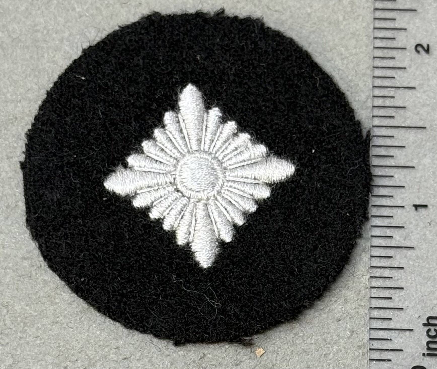 Near-Mint WWII Waffen-SS Oberschütze Rank Pip from Dachau