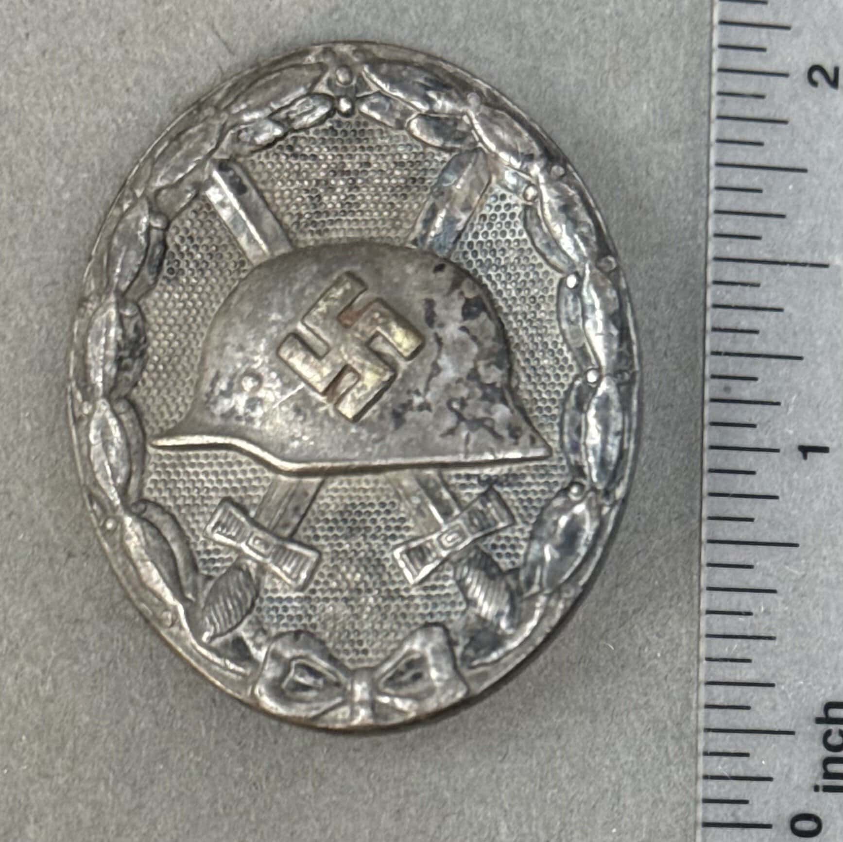 Explore 1939 German Tombak Silver Wound Badge from WWII